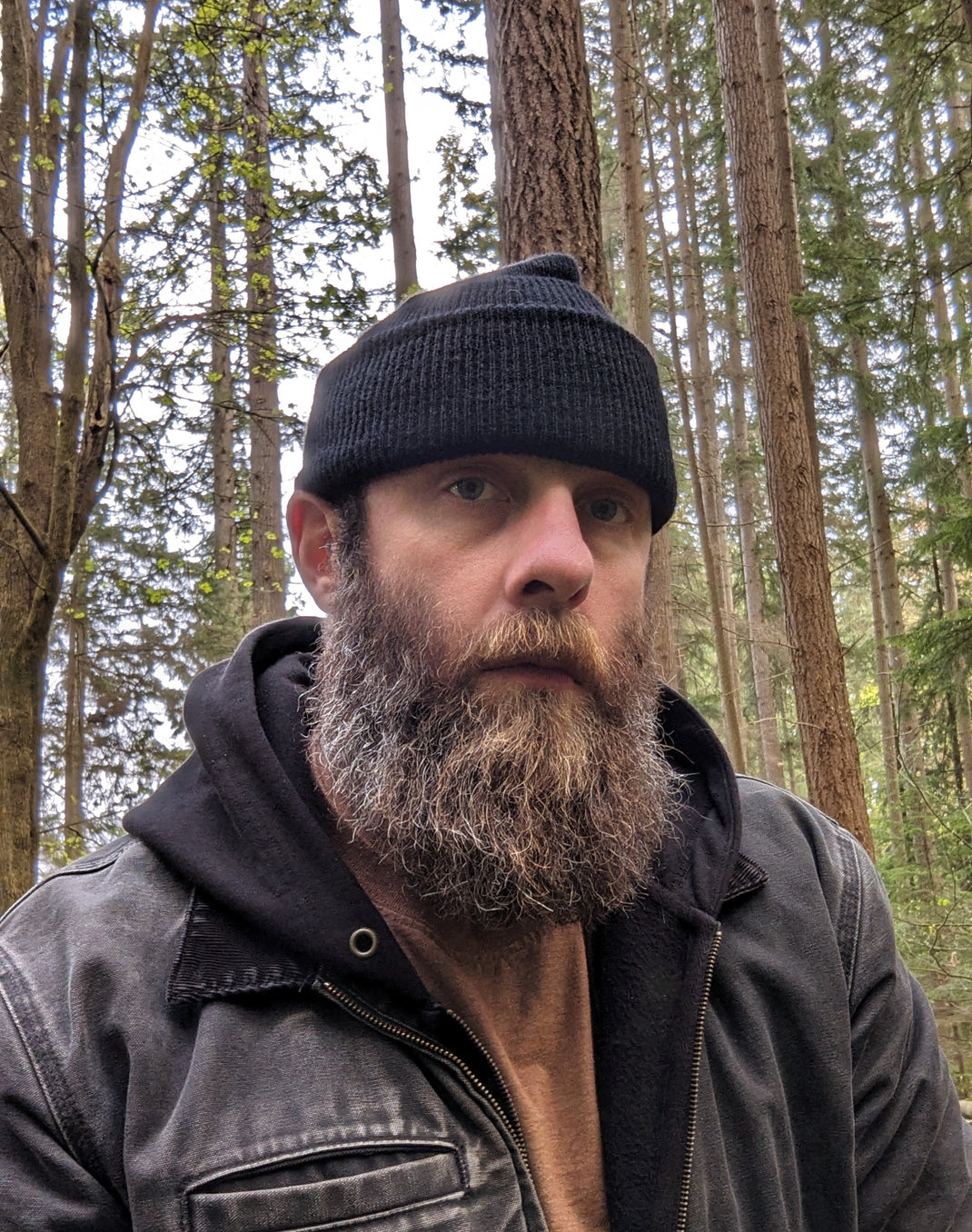 About Us – Black Wool Cap